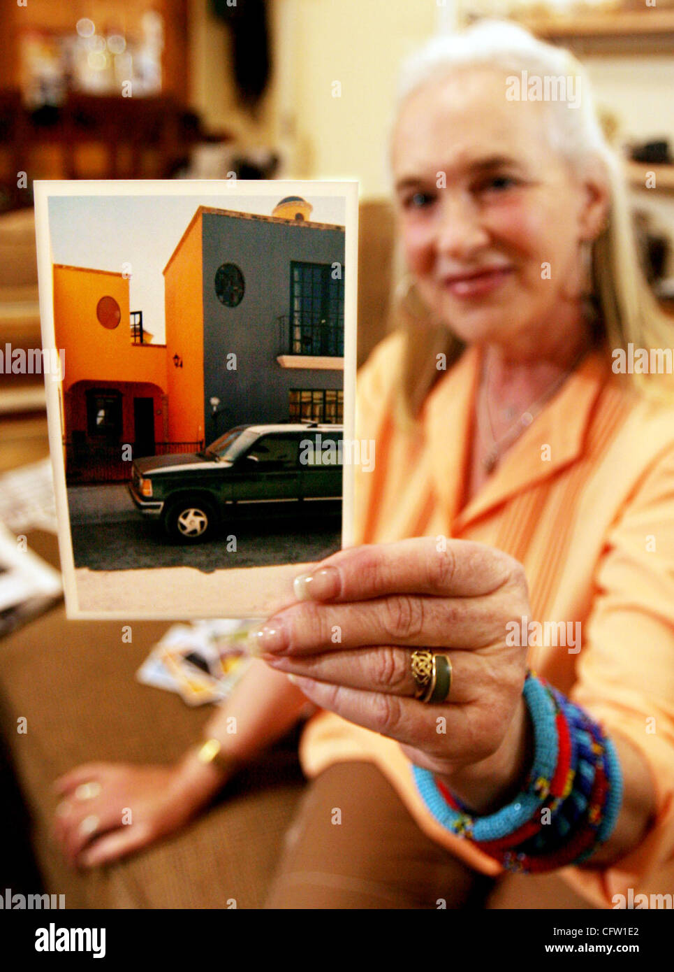 Susan Mintz, of Oakland, Calif., shows a picture of the house that she ...