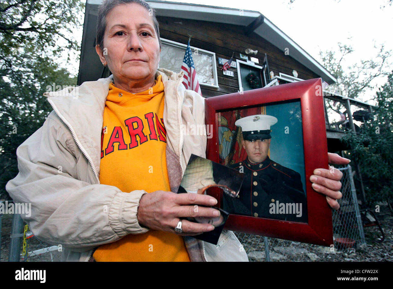 METRO Rose Camero-Gill holds a portrait of her son Corporal Steven Gill ...