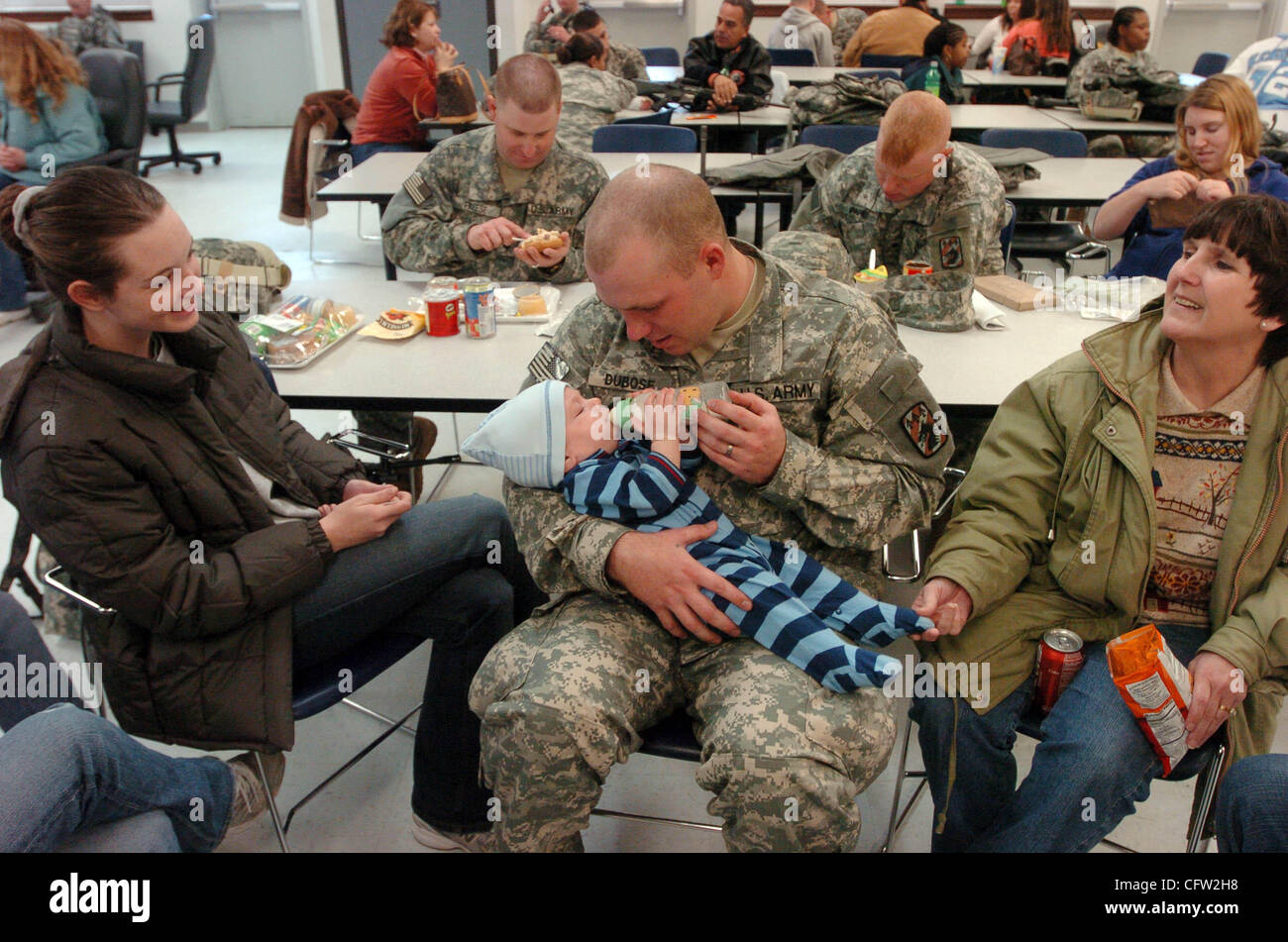 FORT BENNING, GA - FEBRUARY 1: Pfc. Robert DuBose feeds his 5-month-old ...