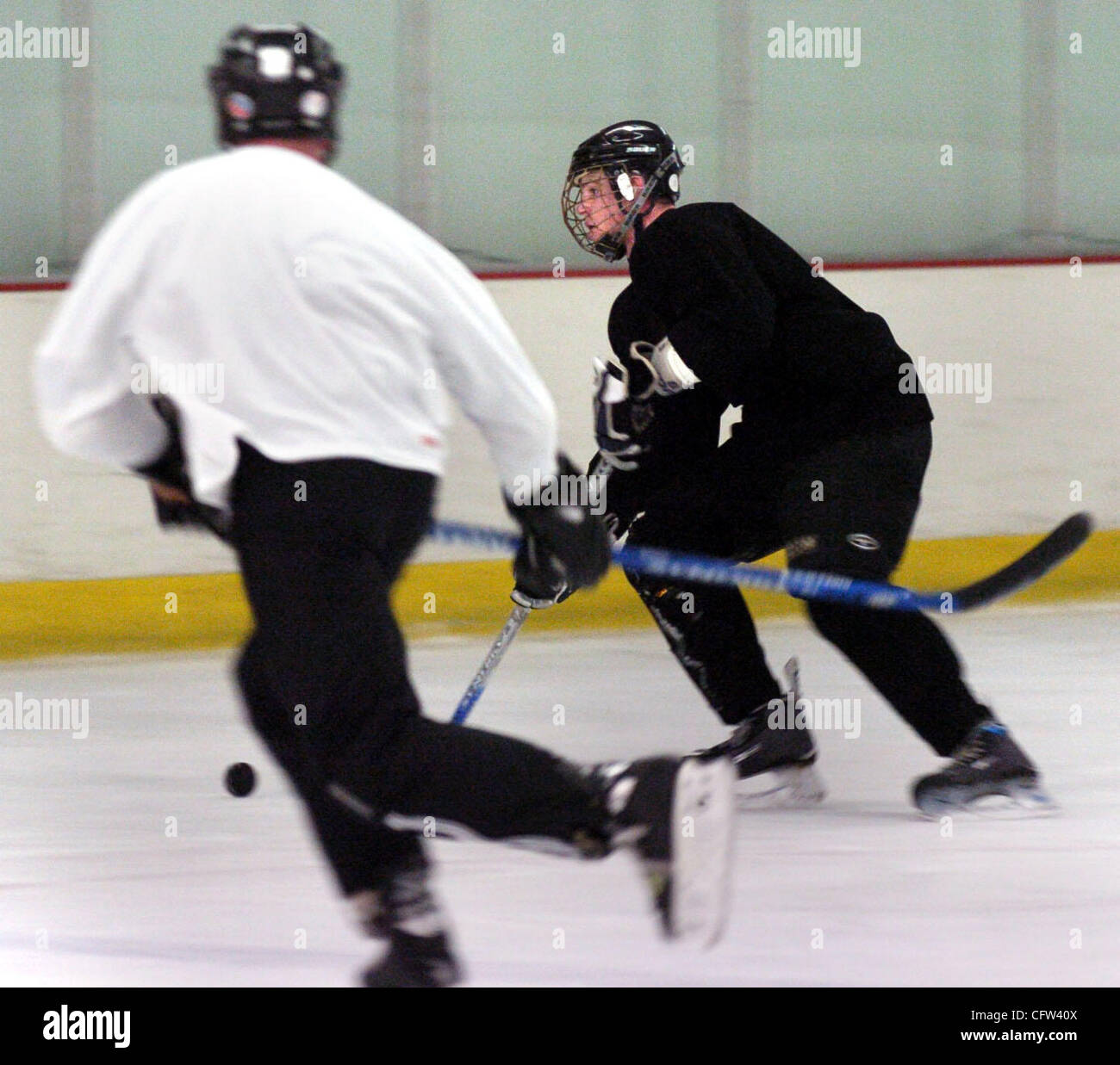 Blue Devils player Michael Hamilton skates with the puck during ...