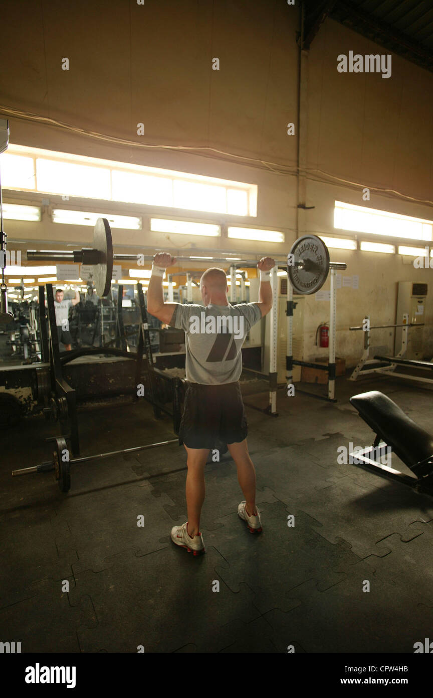 An American soldier works out at a gym in a converted hangar at Forward ...