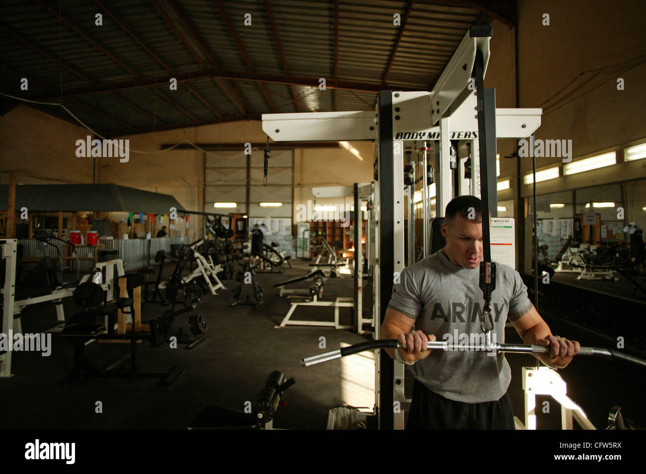US soldiers work out in a converted hangar at Forward Operating Base ...