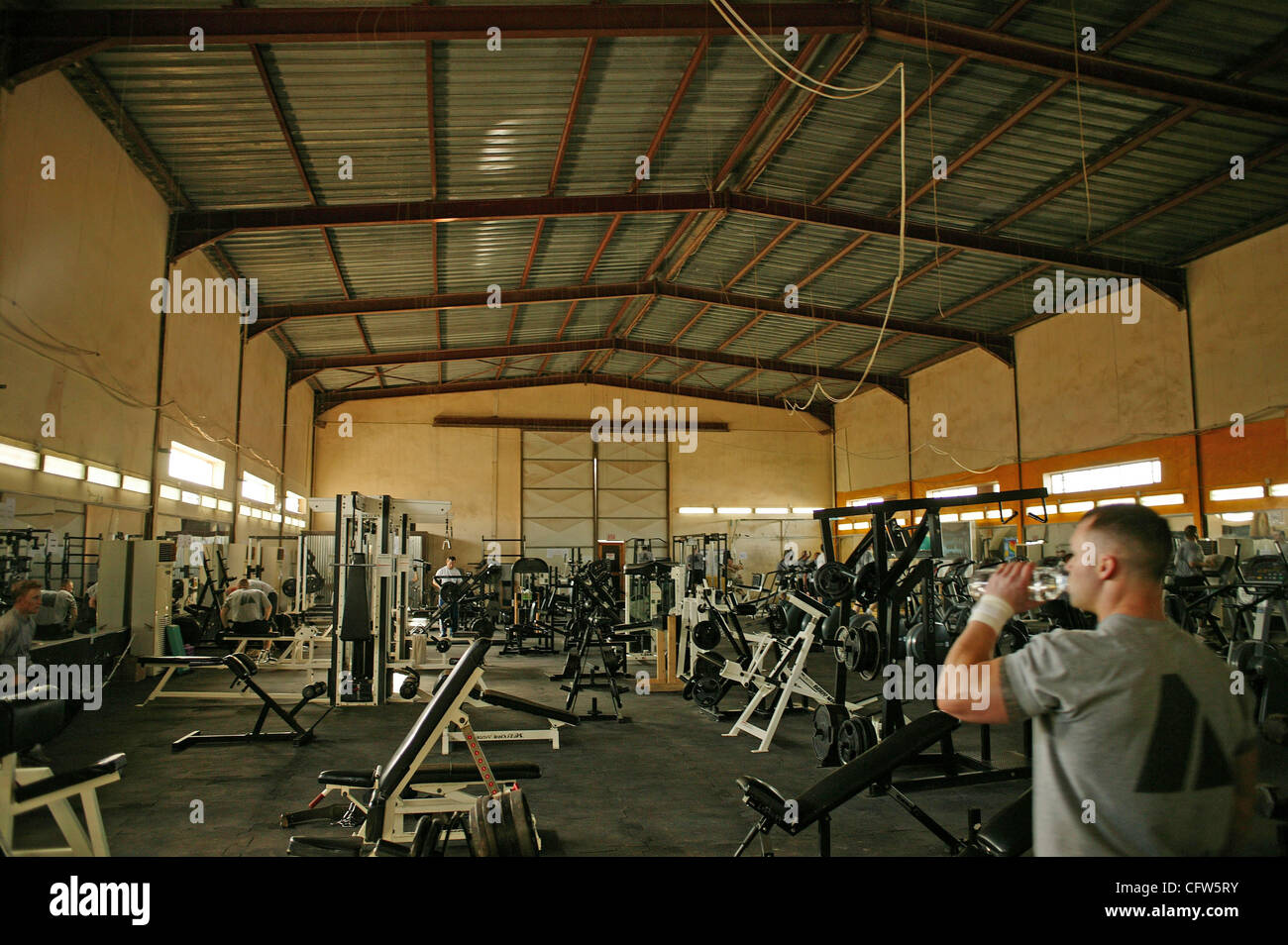 US soldiers work out in a converted hangar at Forward Operating Base ...