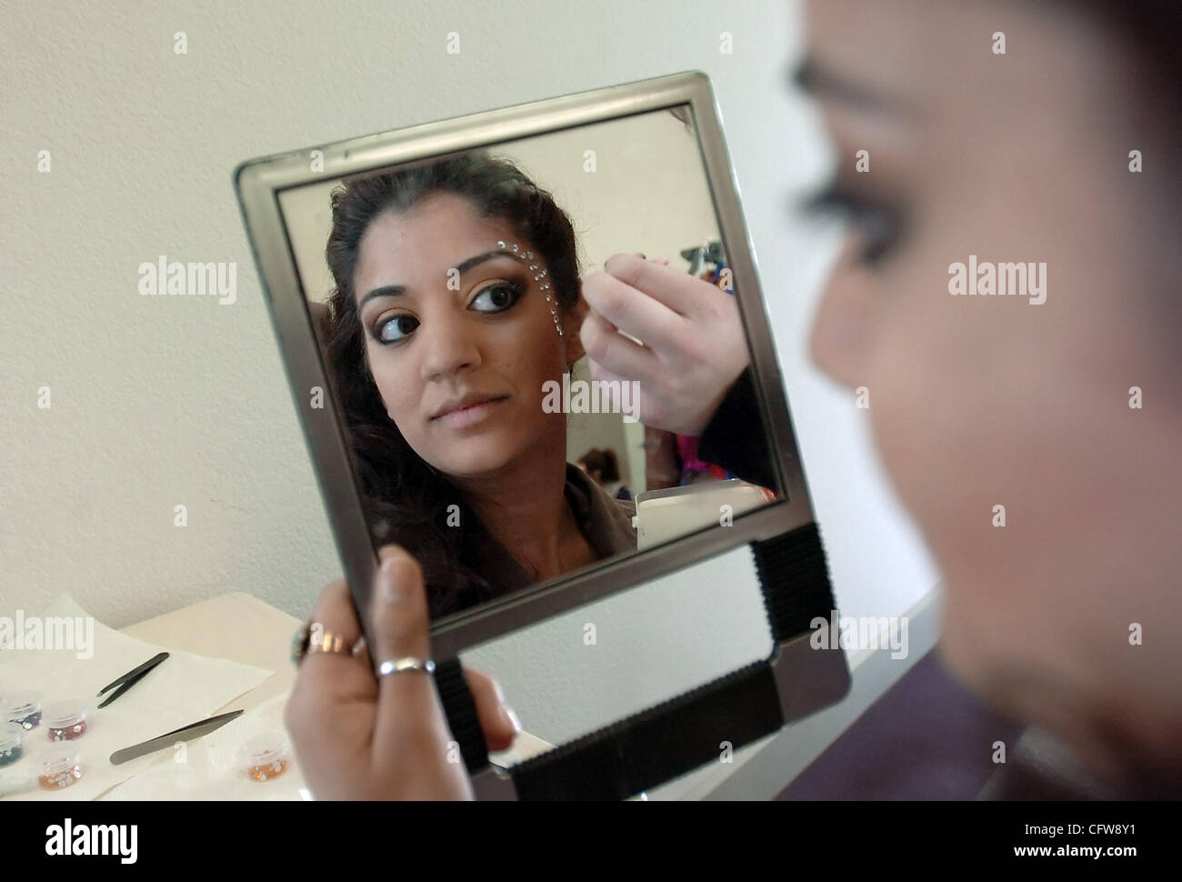 Model Priti Patel, from Los Gatos, sits still as "The Edge" stylist ...