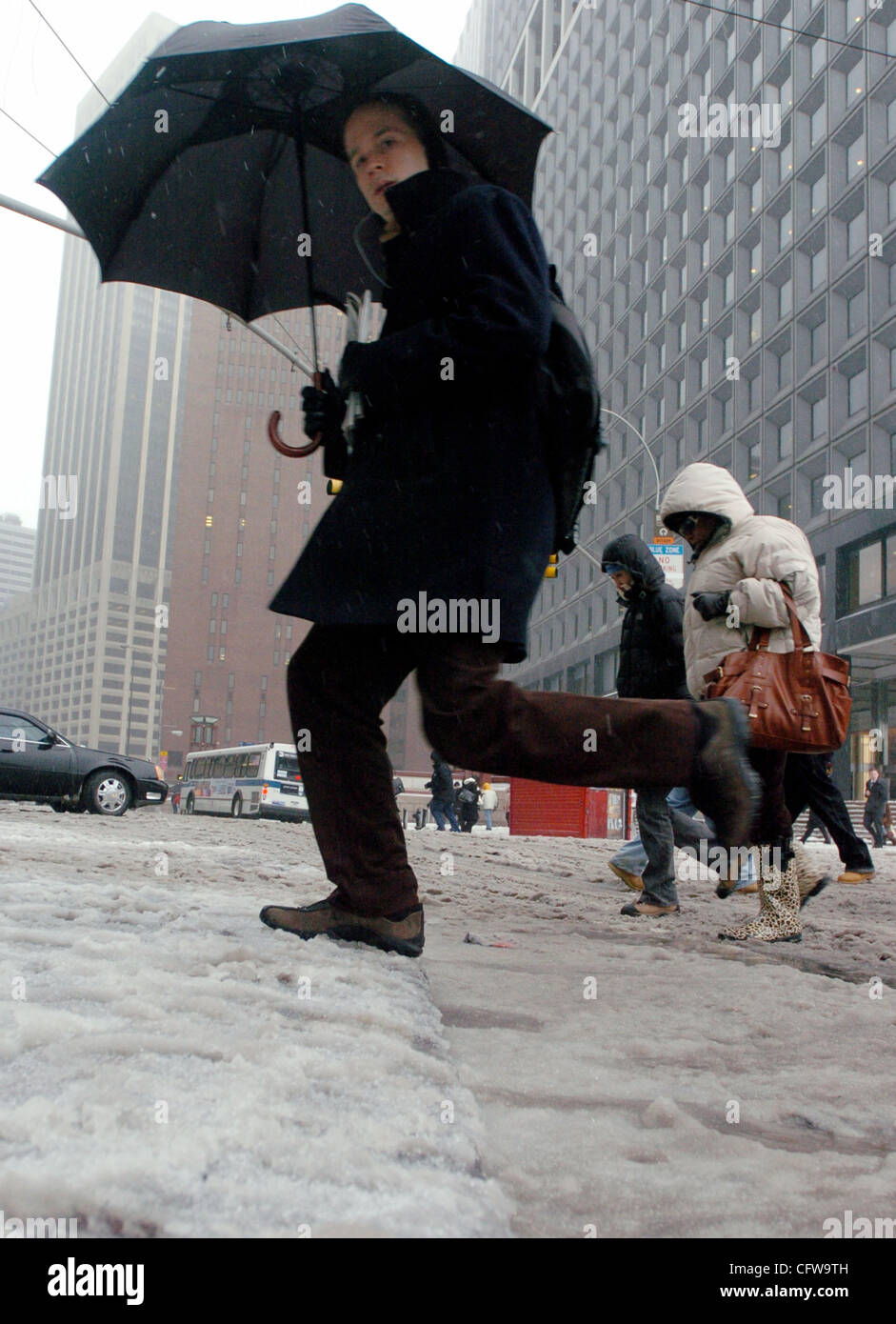 Pedestrians hop over slush puddles along Water Street in lower ...