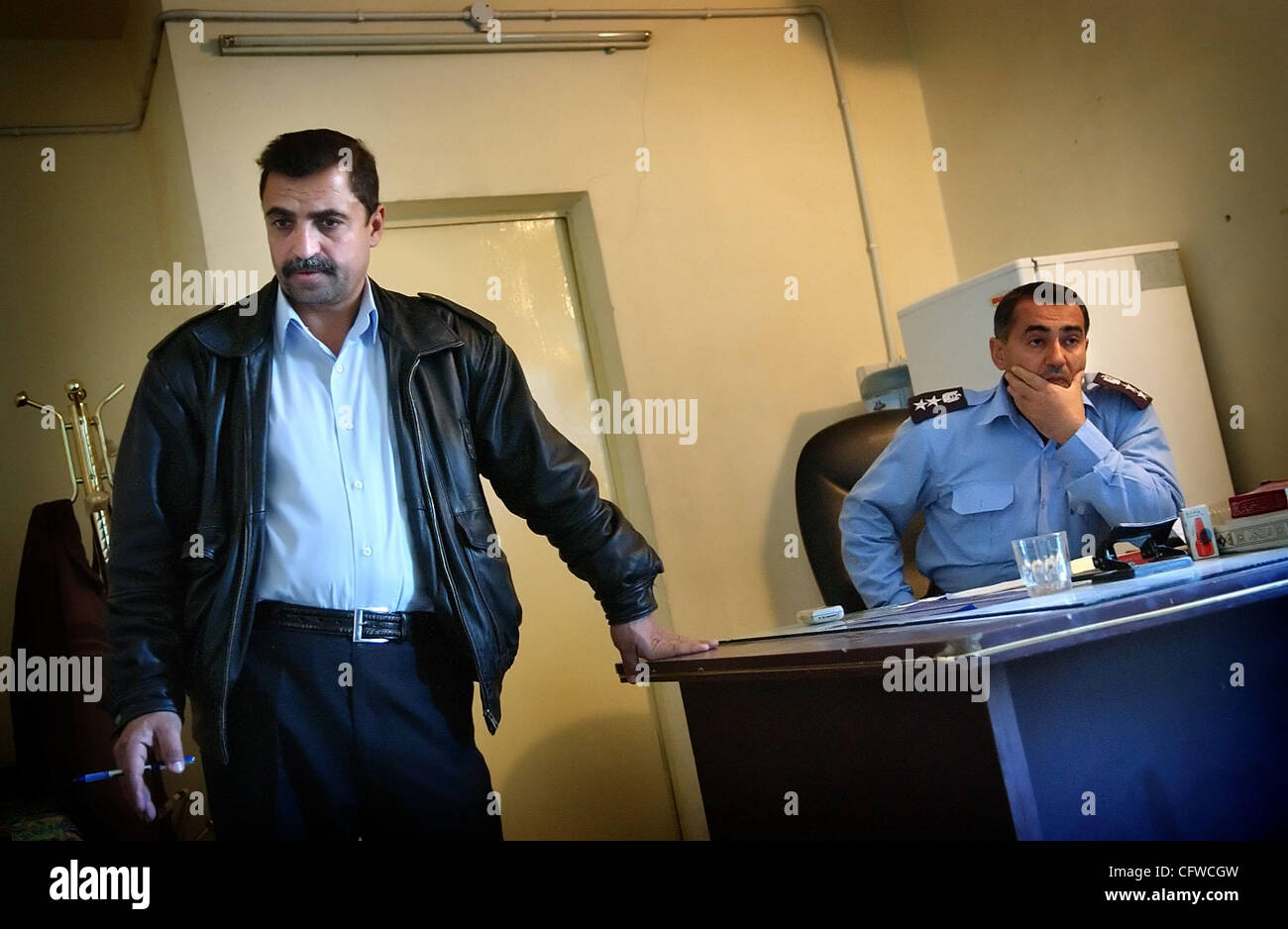 Feb 20, 2007 - Baghdad, Iraq - Iraqi police Colonel Jalal, left, and ...