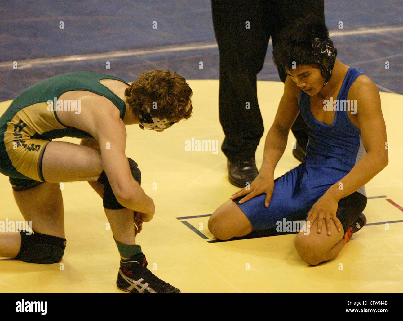 San Leandro's Mark Acosta (right) reacts after losing his quaterfinal ...
