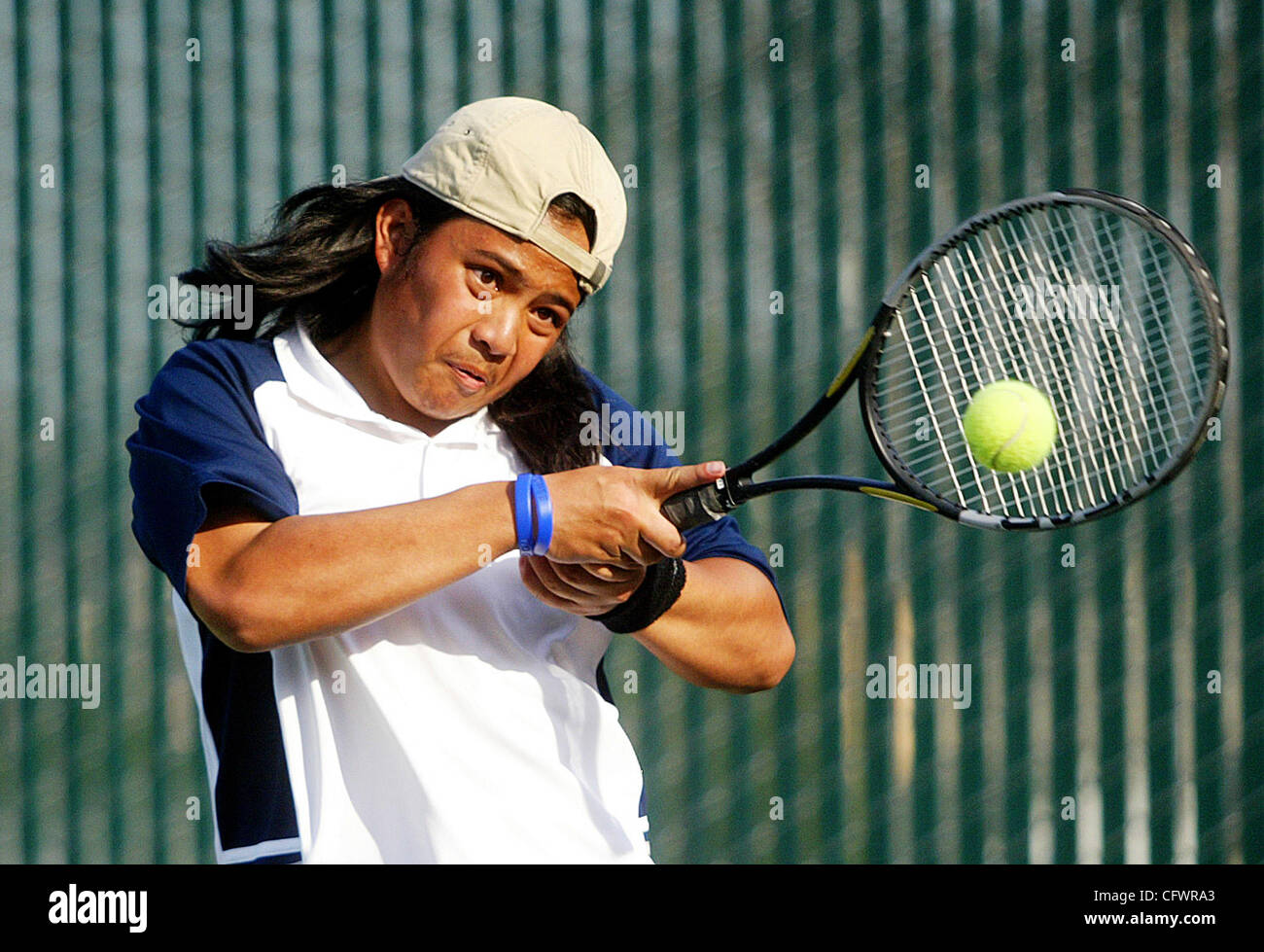San Leandro's Ivan Padilla returns a shot from Mt.Eden's Mike Blanco ...