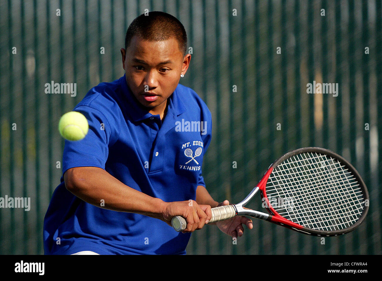 Mt. Eden's Mike Blanco returns a shot from San Leandro's Ivan Padilla ...