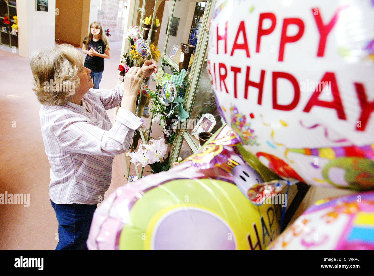 Terri Casteel decorates her daughter Traci Jane Mc Cluskey's niche ...