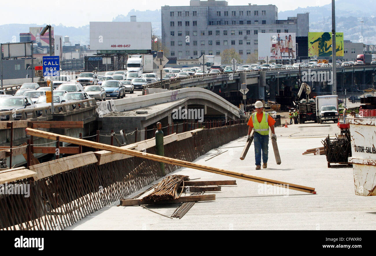 A Caltrans worker on the newer portion of the western approach in San ...