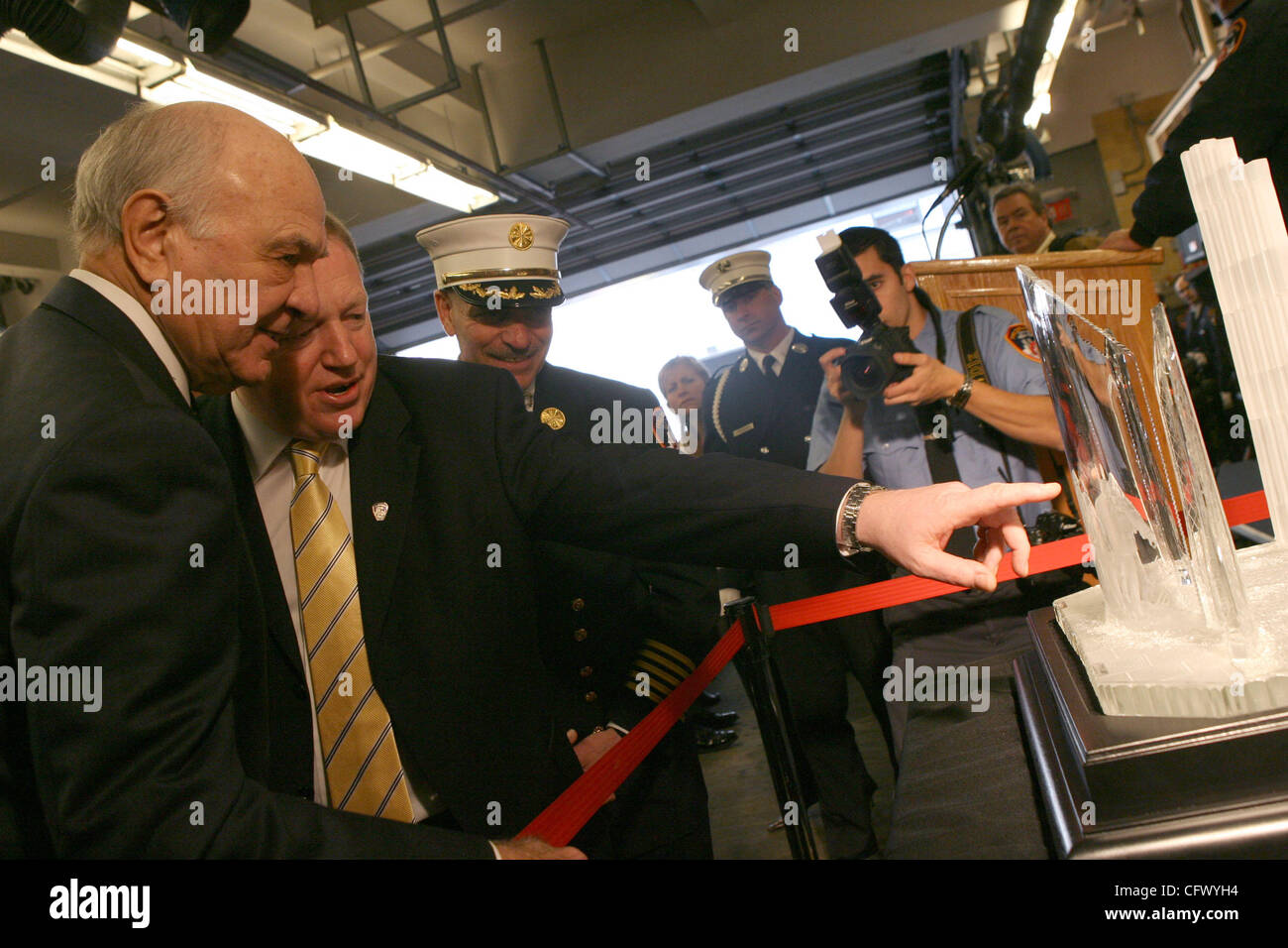 Artist Sean Egan showing Fire Commissioner Nicholas Scoppetta the ...