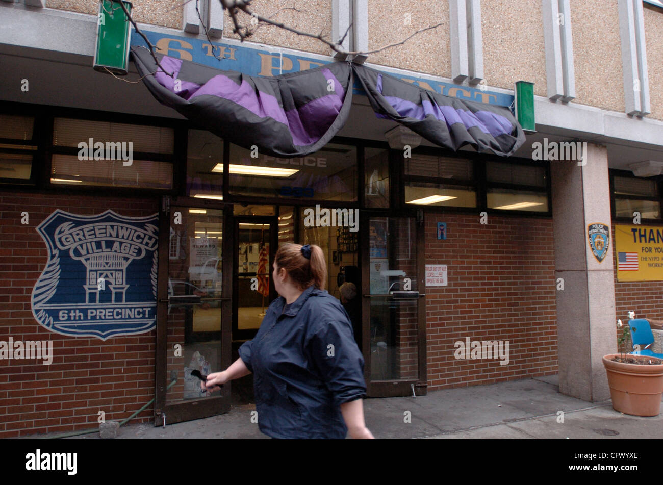 Purple and black bunting hangs from facade of the 6th Precinct, where ...