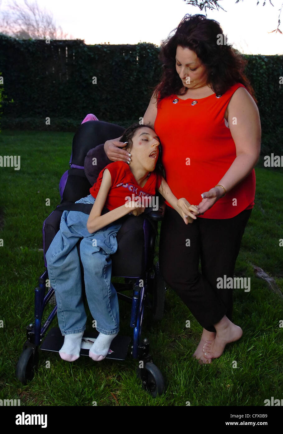 Annette Olguin, from Dublin, comforts her daughter Shelly Guinn, age 27 ...