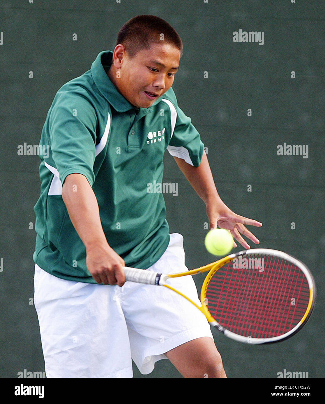 Moreau's Mark DeCastro returns a shot from Arroyo's Joshua Siu during ...