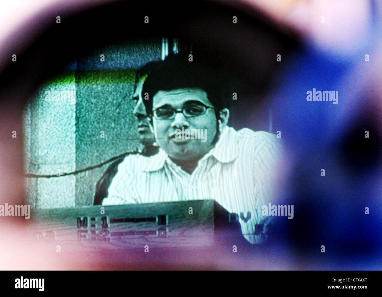 Independent journalist Josh Wolf, seen on the viewfinder of a video ...