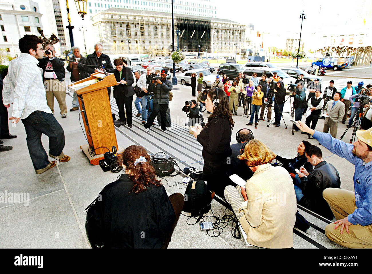Independent journalist Josh Wolf, left, addresses to journalists from ...