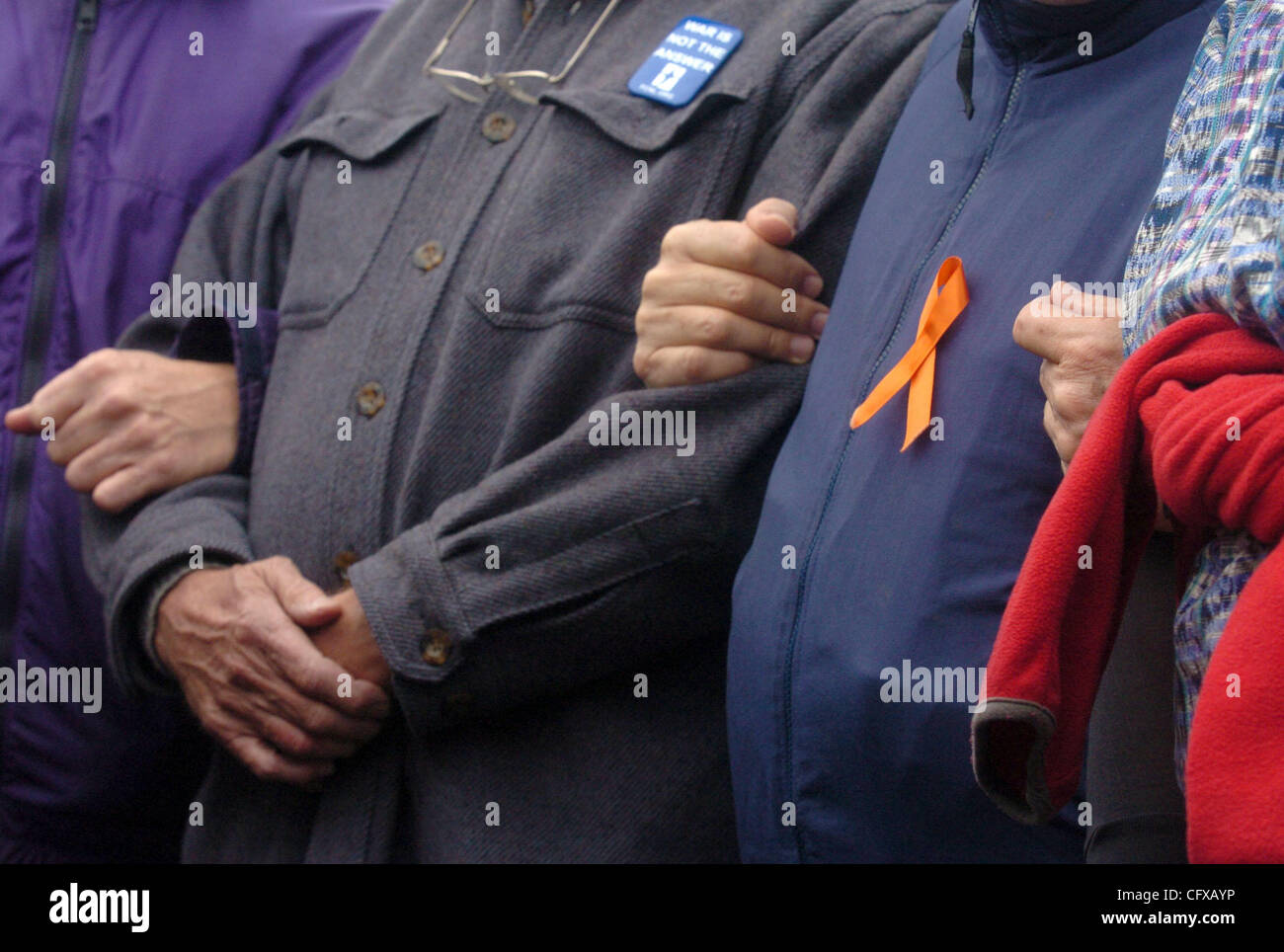 Protesters stand in solidarity during the annual Good Friday march and ...