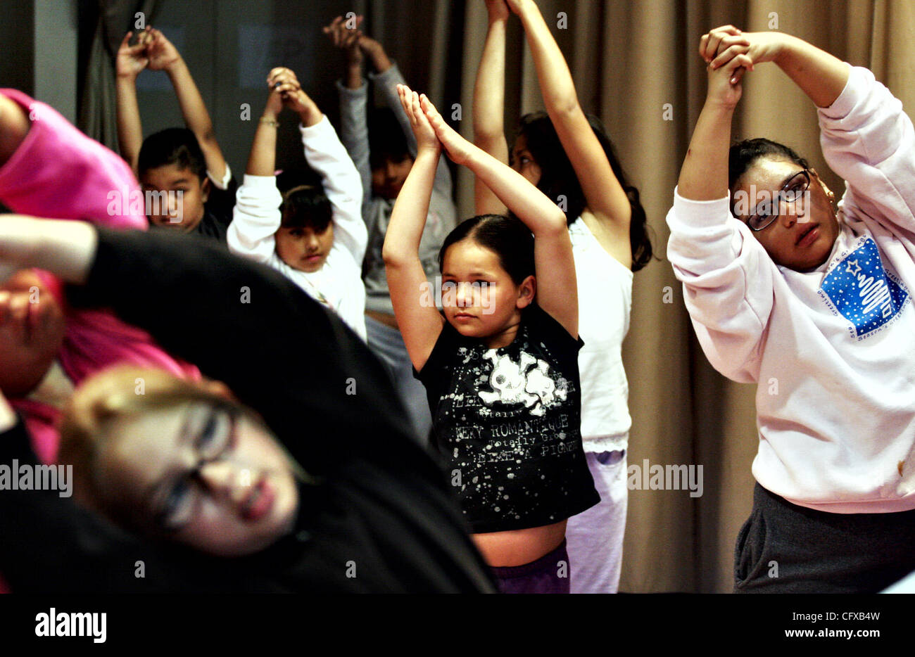 Alicia Rice, 8, (center) joins other students as they take part in kids ...
