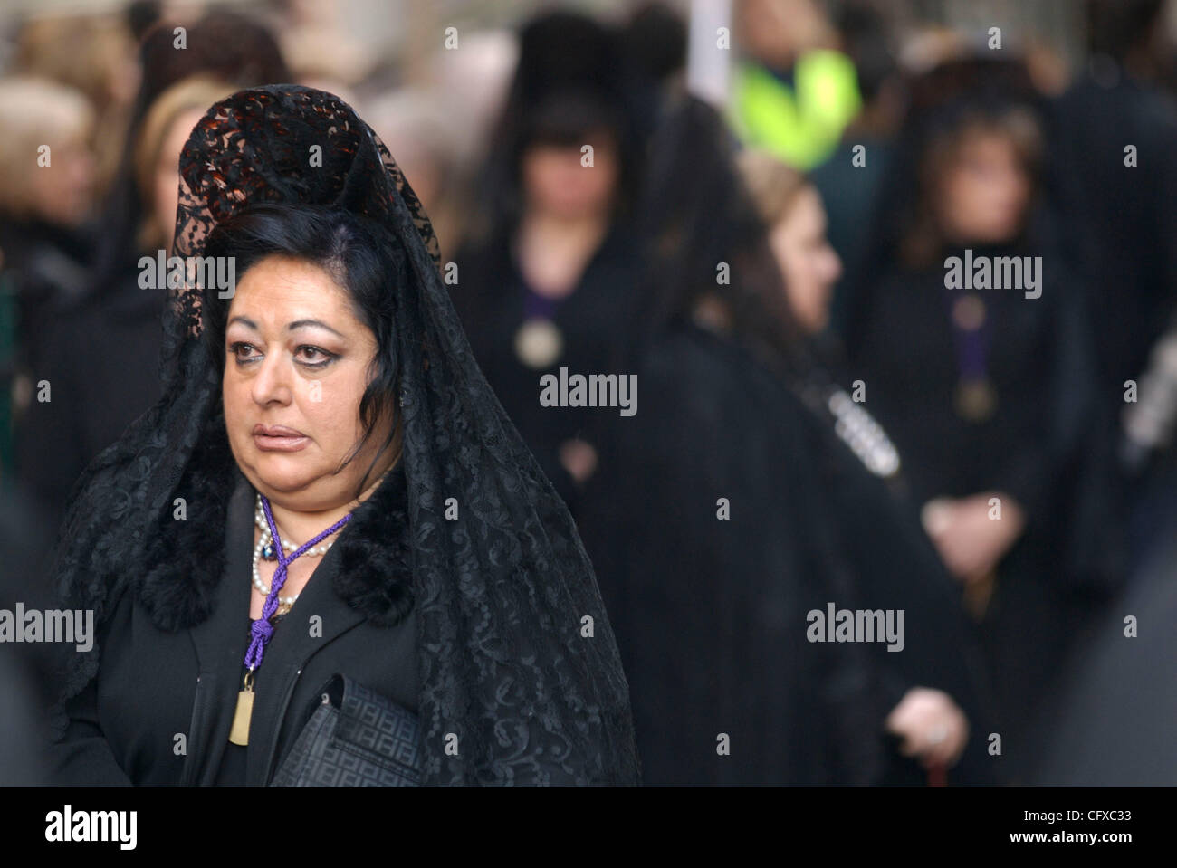A woman wearing the traditional ornamental Spanish head covering ...