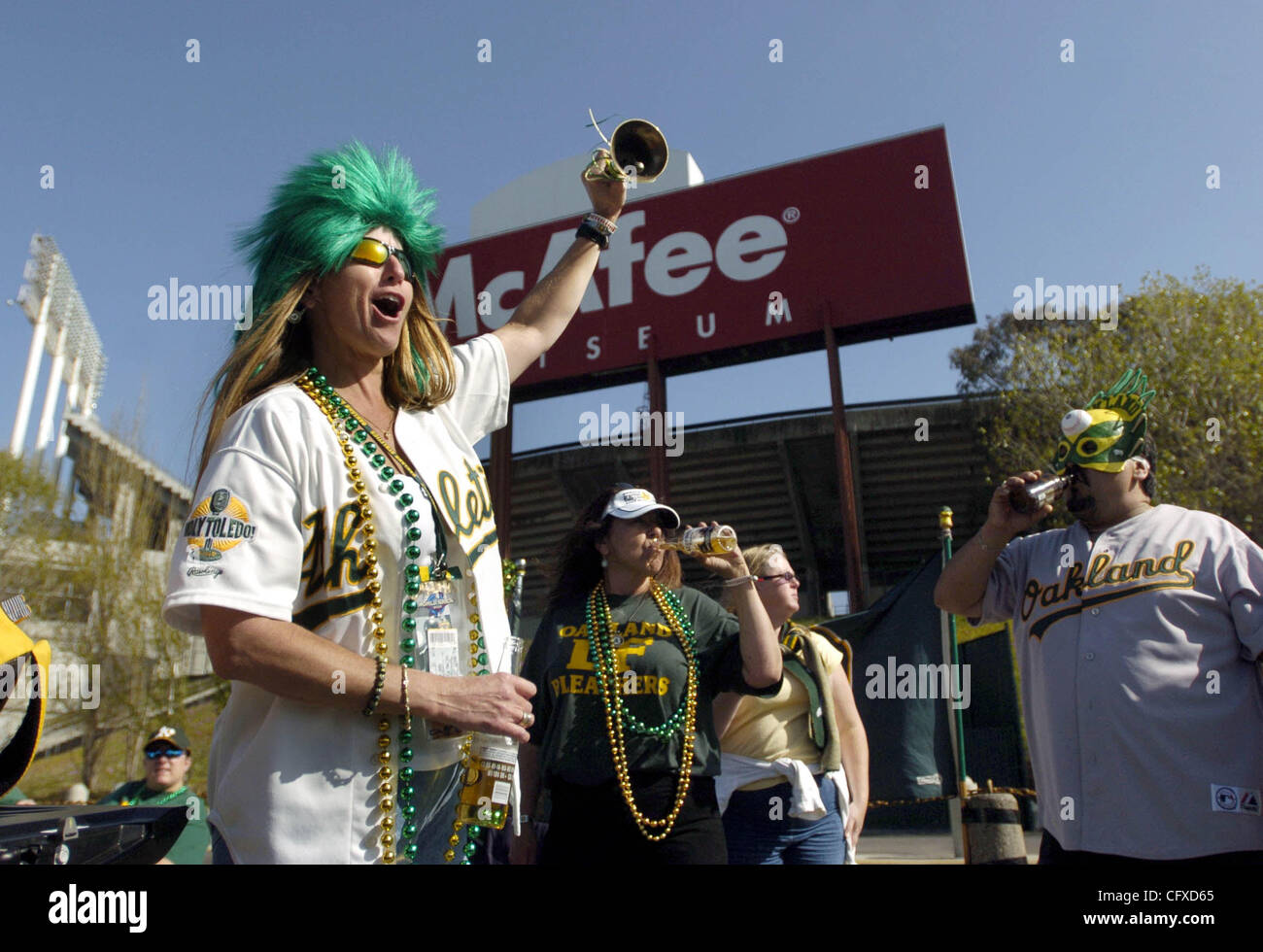 Dana Morgan of Pinole rings her game bell as she tailgates with friends ...
