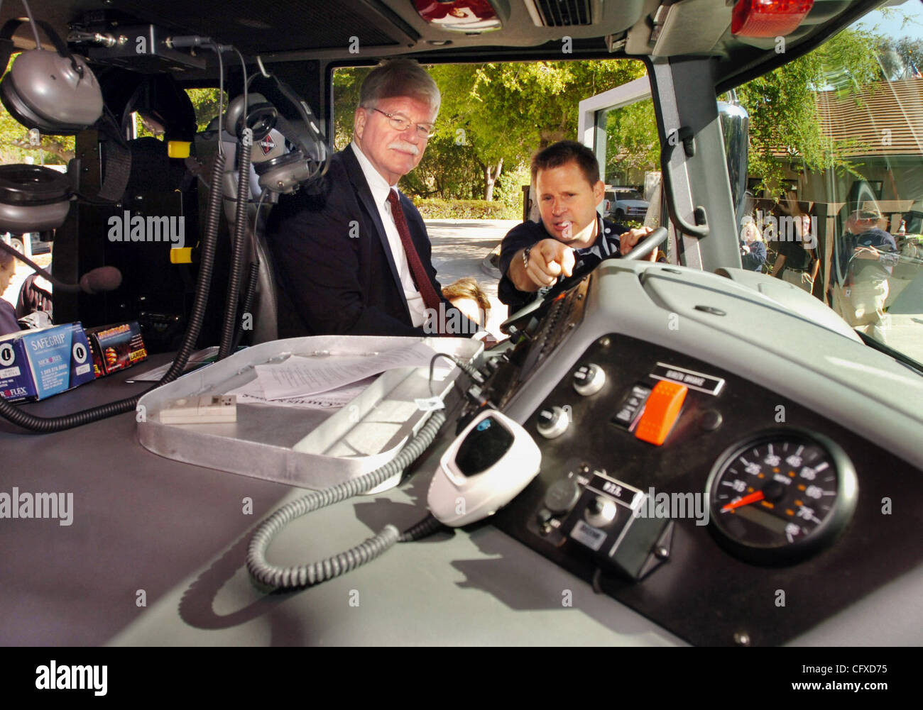 Congressman George Miller, left, climbs into the driver's seat of the ...