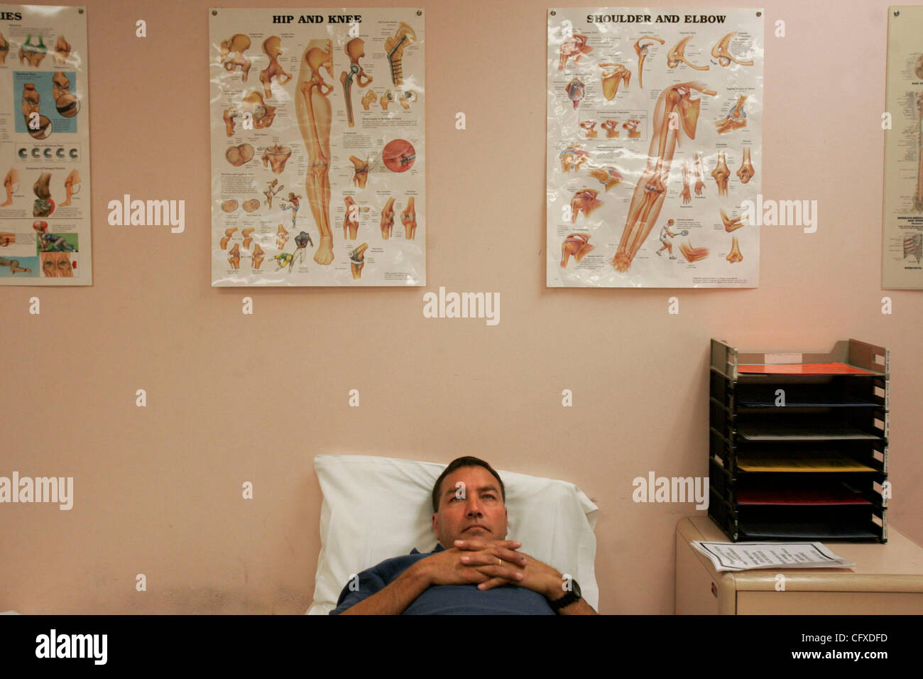 METRO -Lt. Colonel Raymond Rivas waits to have his knee iced at ...