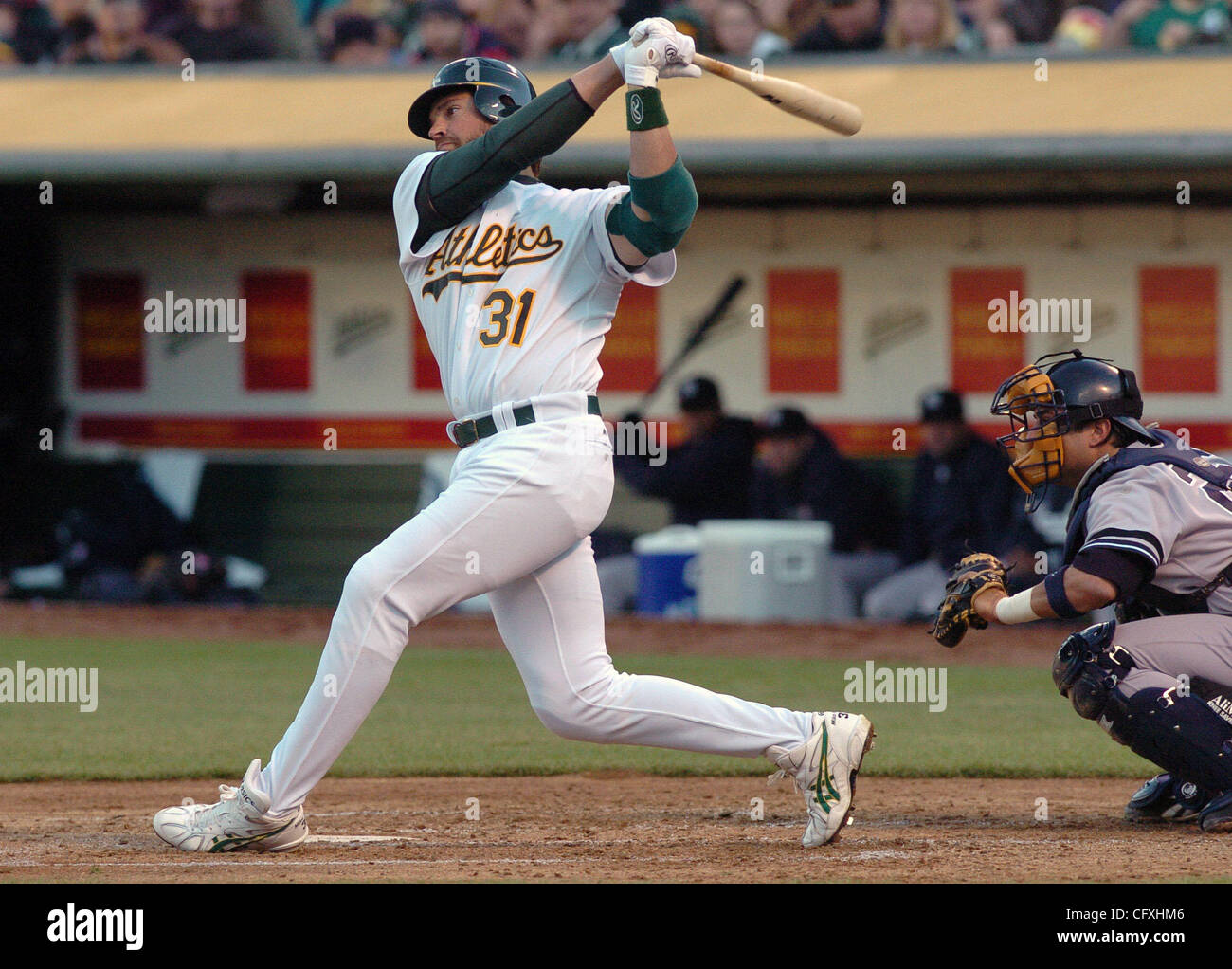A's Mike Piazza swings at a pitch during a game at McAfee in Oakland ...
