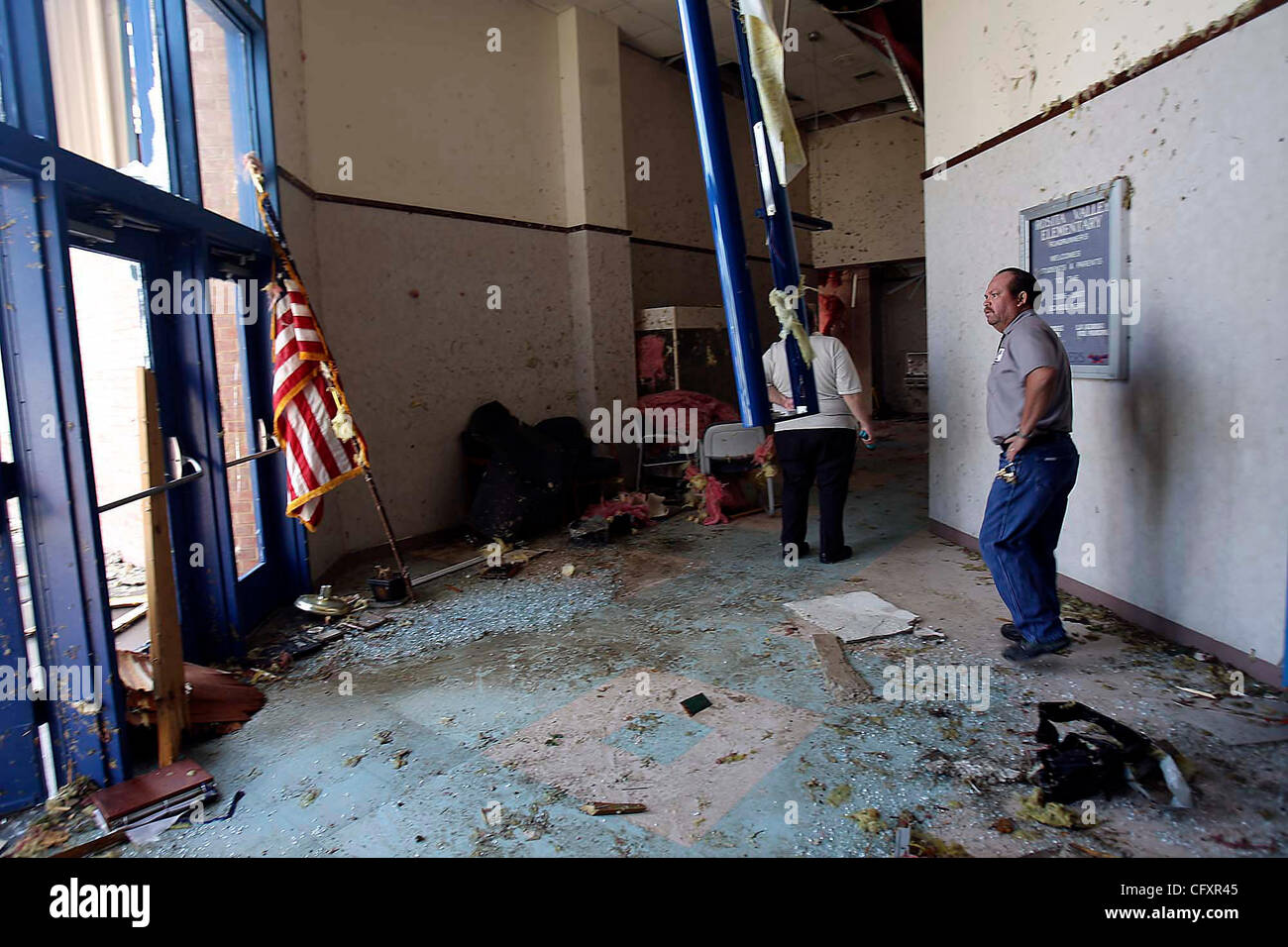 STATE- School personel survey the damage to the Rosita Valley ...