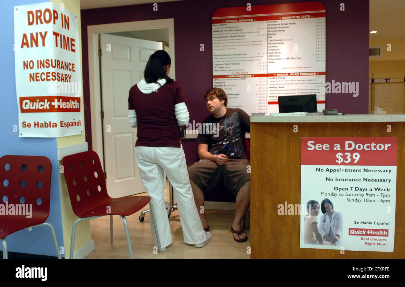 Medical assistant Beatriz Tinoco asks questions of patient Mike Wright ...