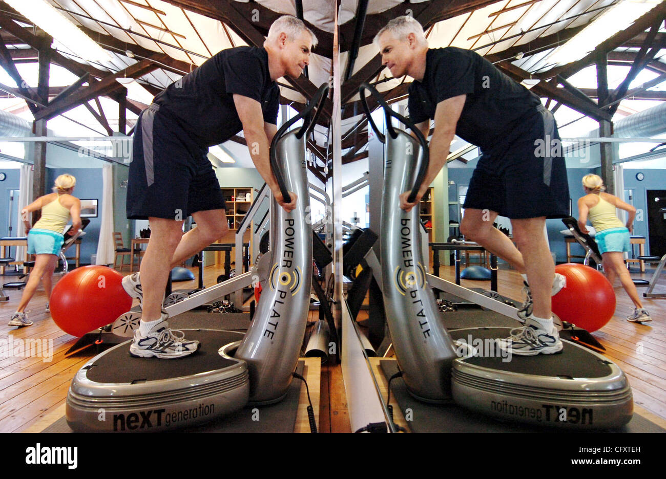 Athletic trainer Alex Margolin works out on Power Plate vibration ...