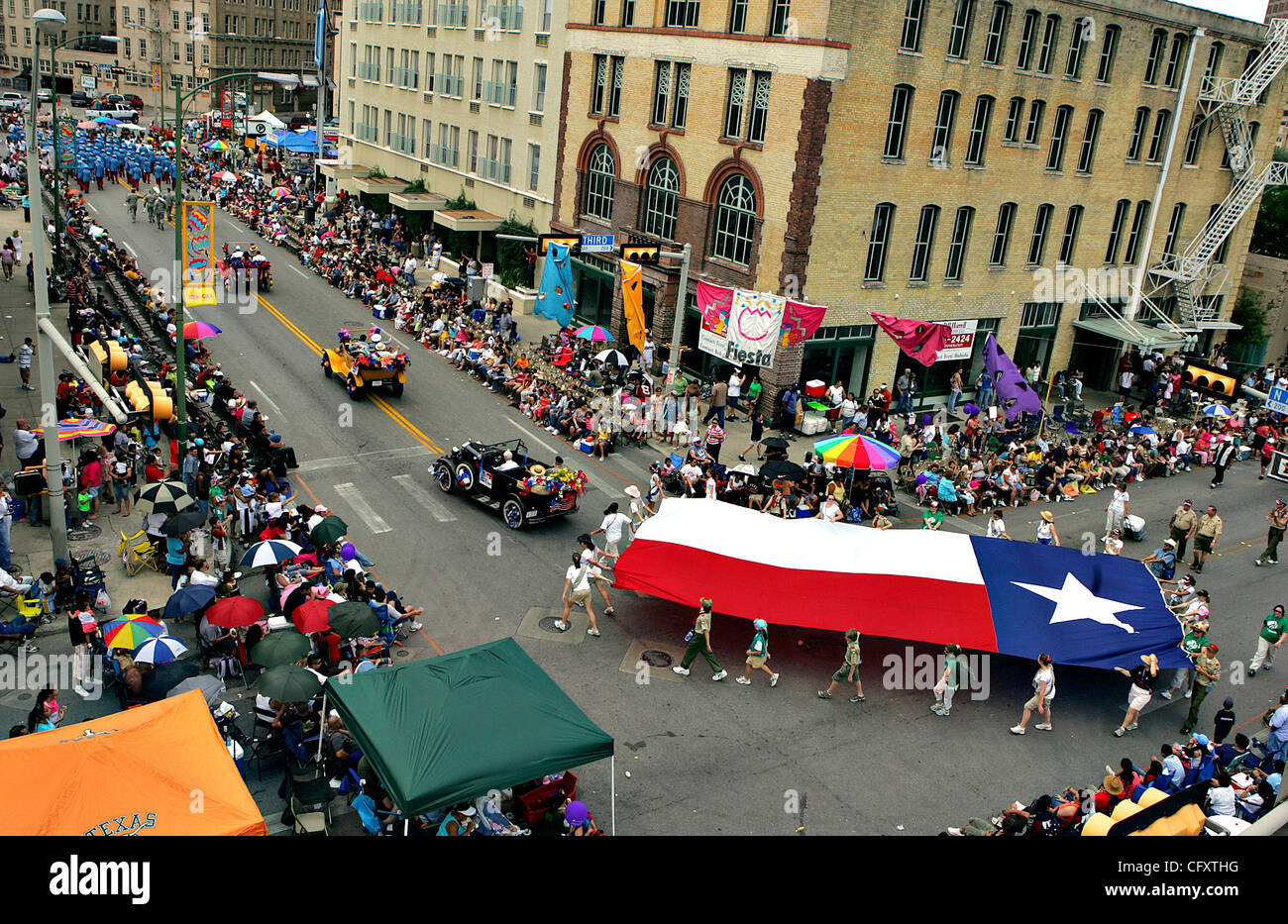 METRO - 1:25 PM - The Texas Flag is carried during the Fiesta Battle of ...