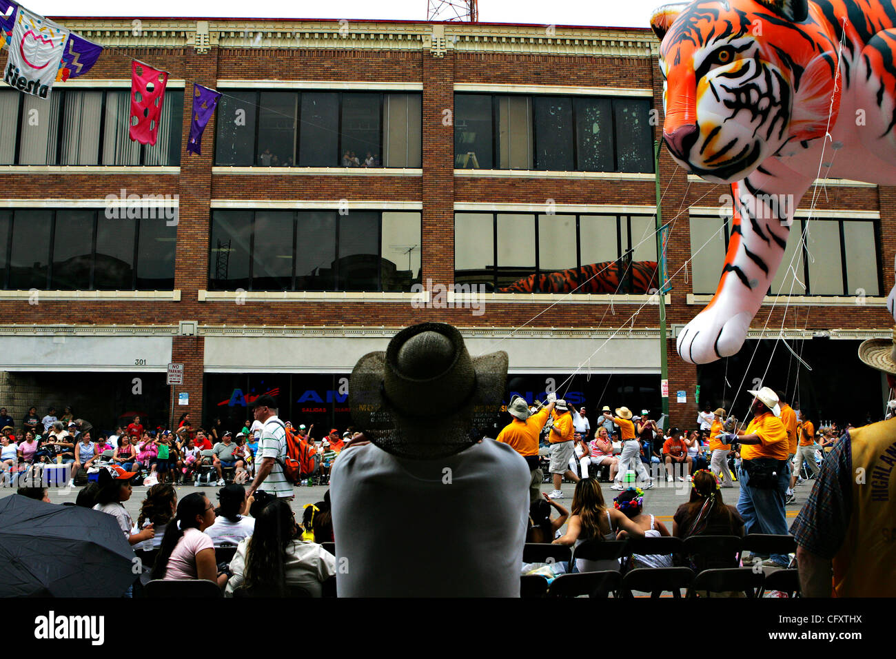METRO - 2:17 PM - The Trinity University Tiger passes the crowd during ...