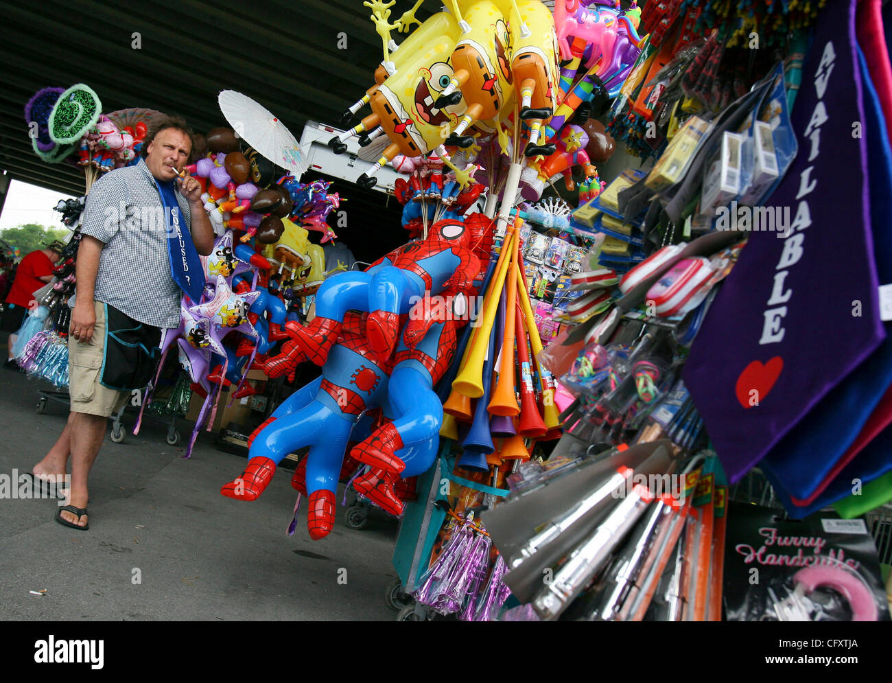 9:00AM Fiesta Vendor Steve Huntsman relaxes with a cigarette before ...