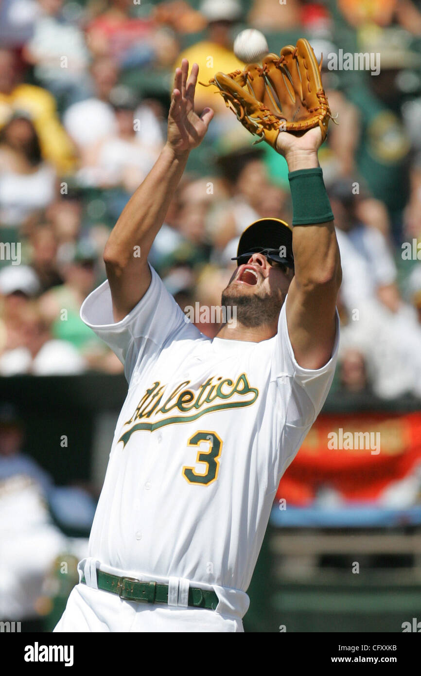 Oakland Athletics Eric Chavez catches a foul ball hit by Tampa Bay ...