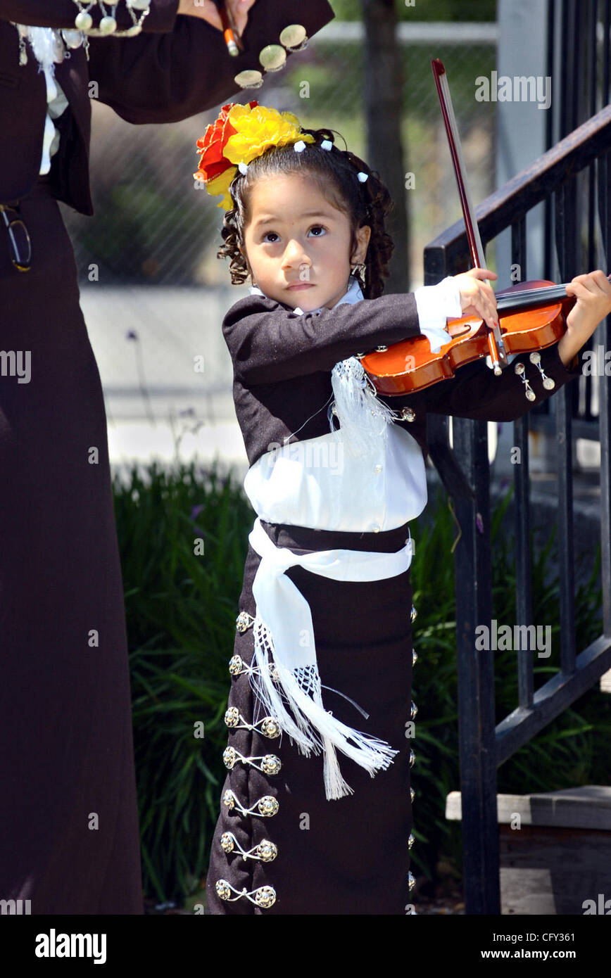 Kristina Castillo ( 5, Tracy) watches an older player while performing ...