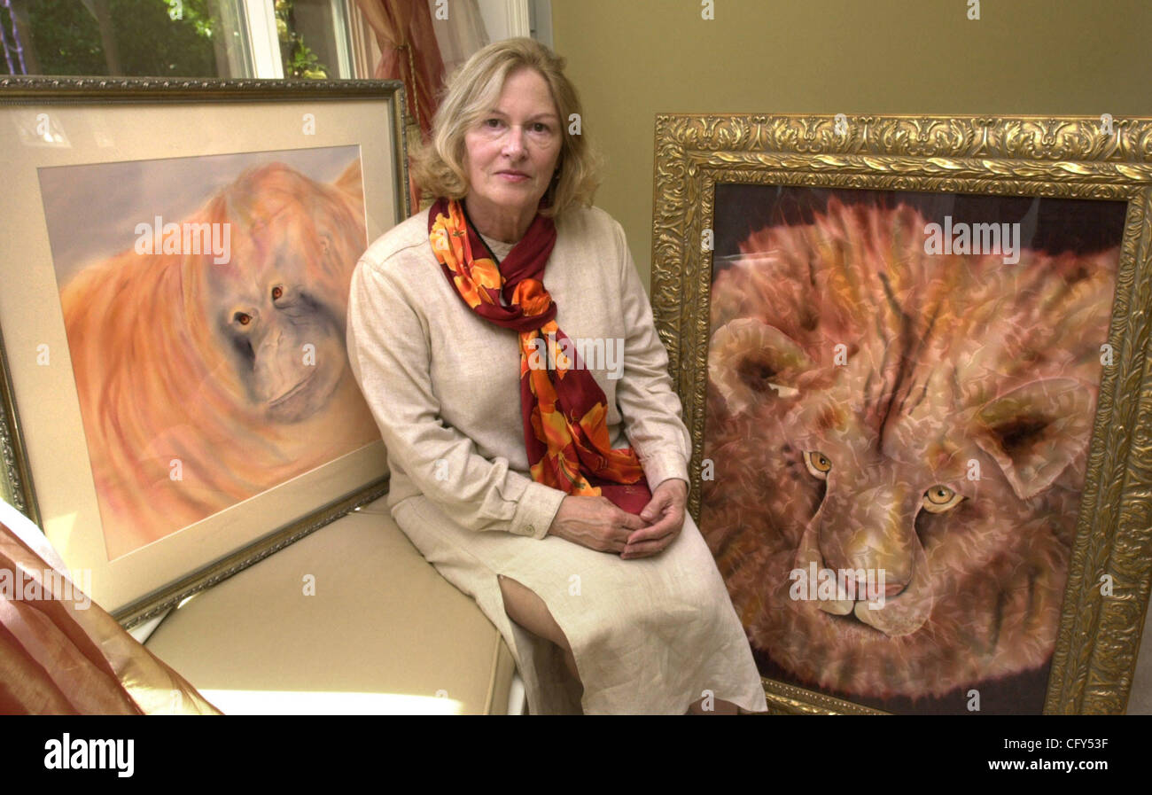 Artist Joan Monroe poses with some of her artwork in Walnut Creek ...