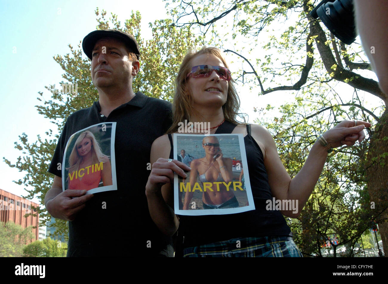 Gregory Moore (L) and Chris Weller (R), both of Manhattan, hold up ...