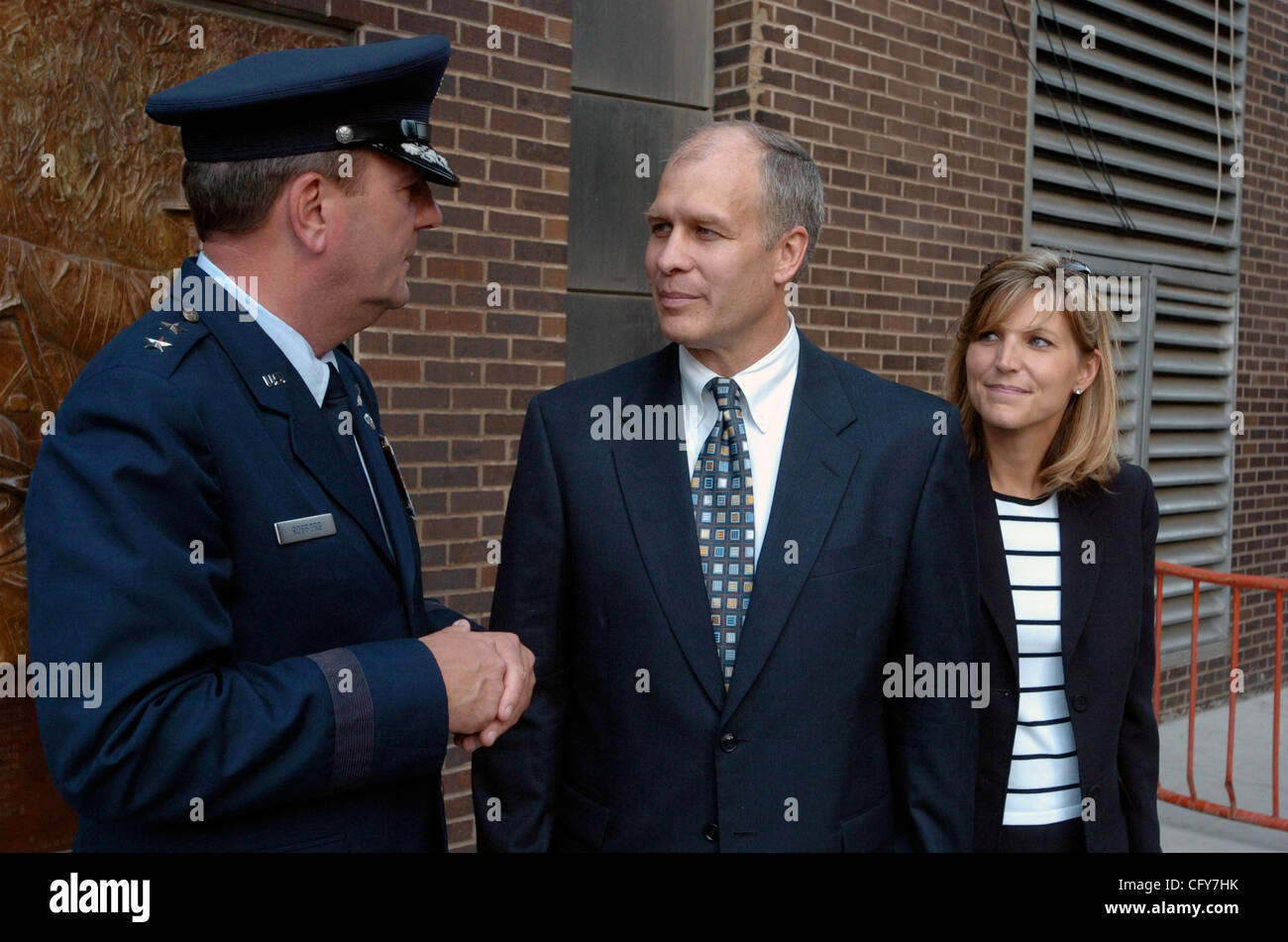 Maj. General Rick Rosborg (L) speaks with Dr. Alan Flower and his wife ...