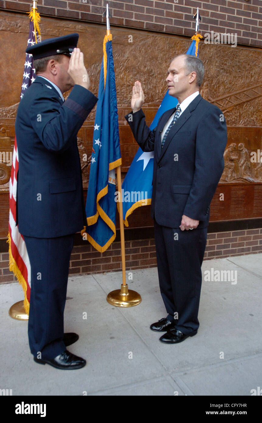 Maj. General Rick Rosborg swears in Dr. Alan Flower. Dr. Alan Flower ...
