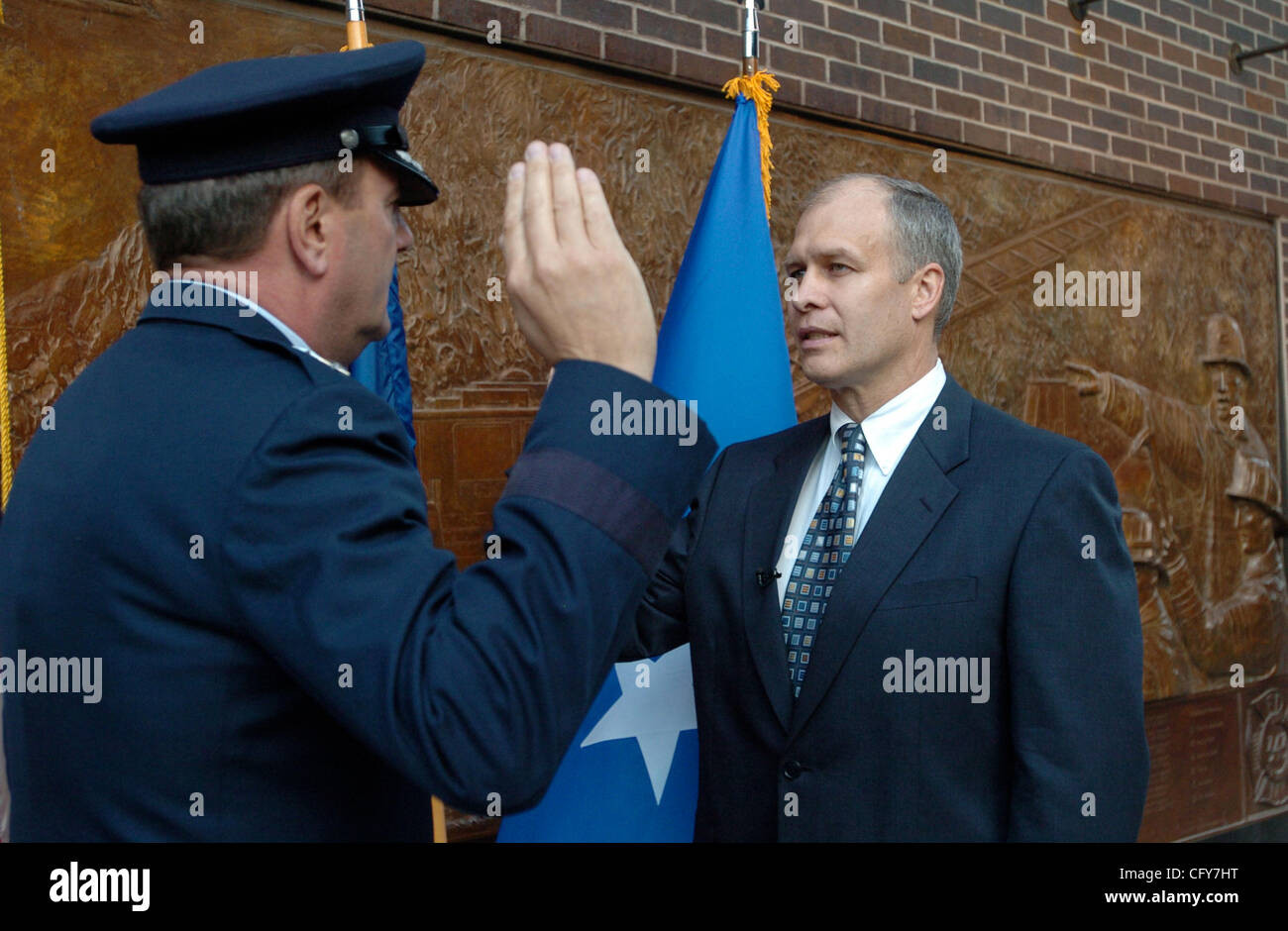 Maj. General Rick Rosborg swears in Dr. Alan Flower. Dr. Alan Flower ...