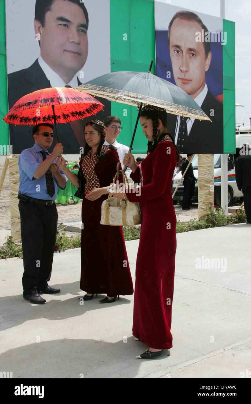 Russian President Vladimir Putin visiting Turkmenistan. Portraits of ...