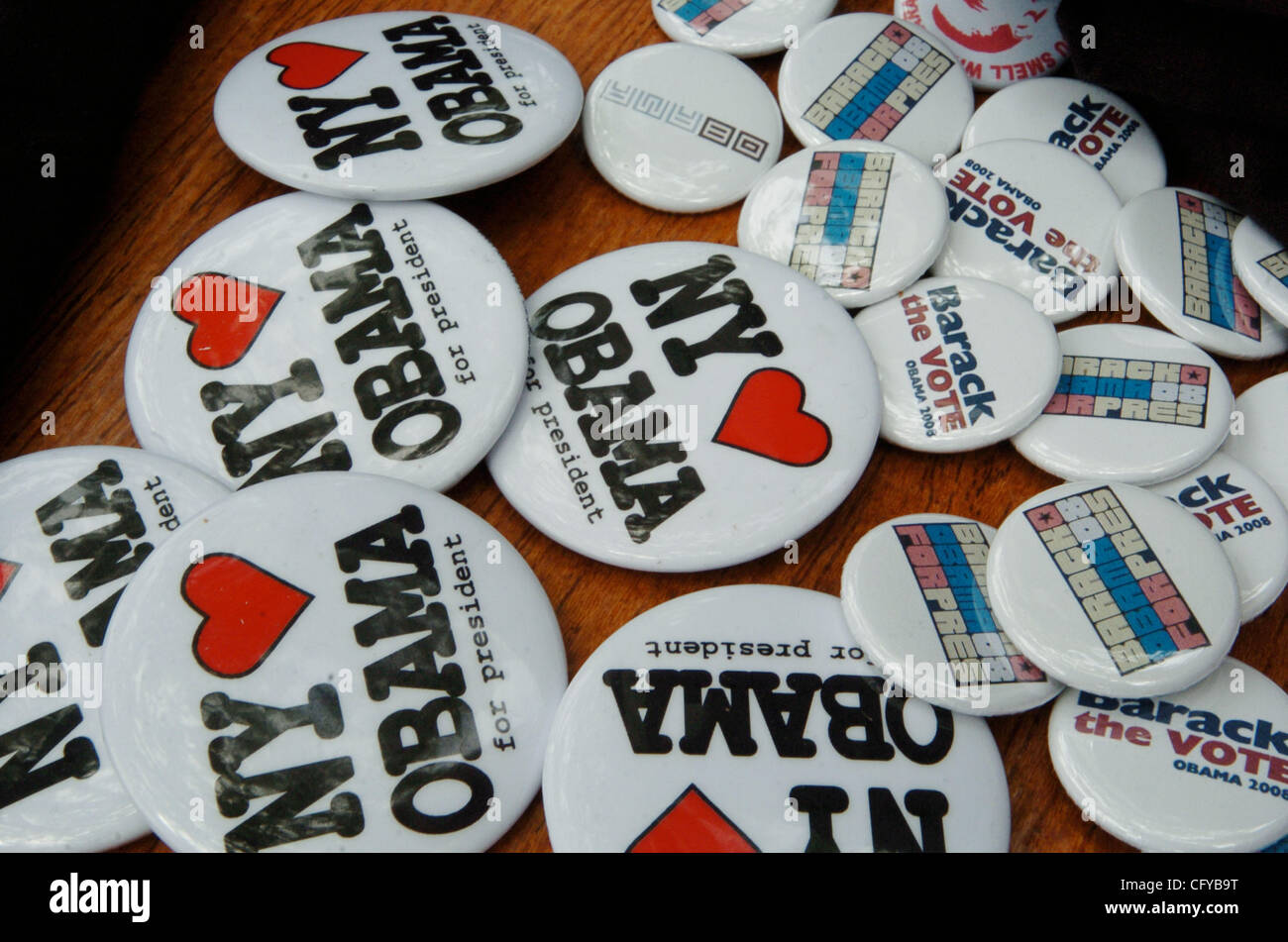 Campaign buttons lay on a table as supporters of Senator Barrack Obama ...