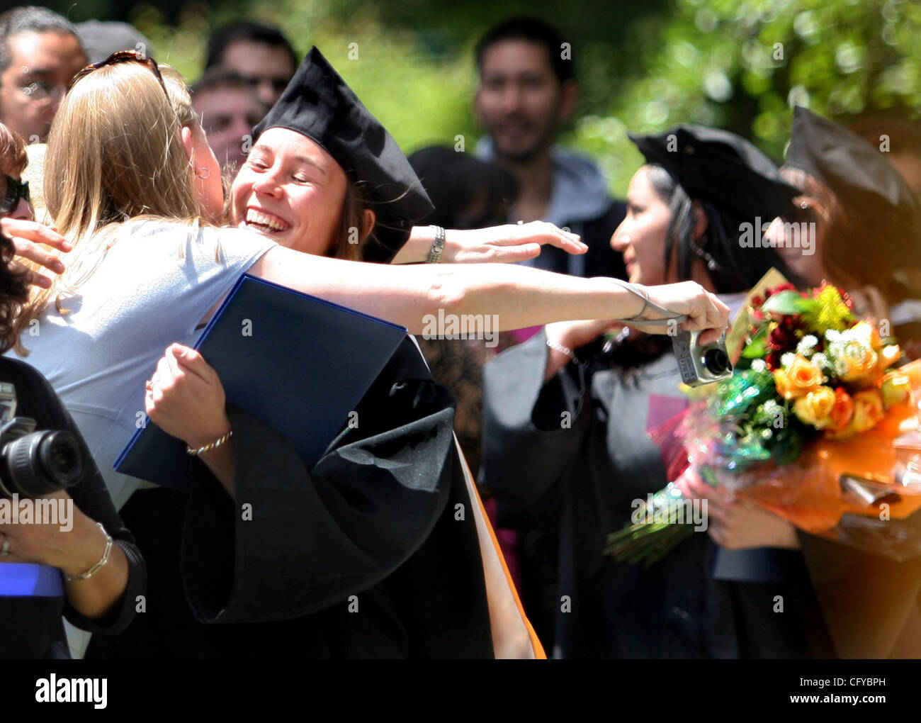 Julia Timpson, center, is congfratulated by unidentified person after ...
