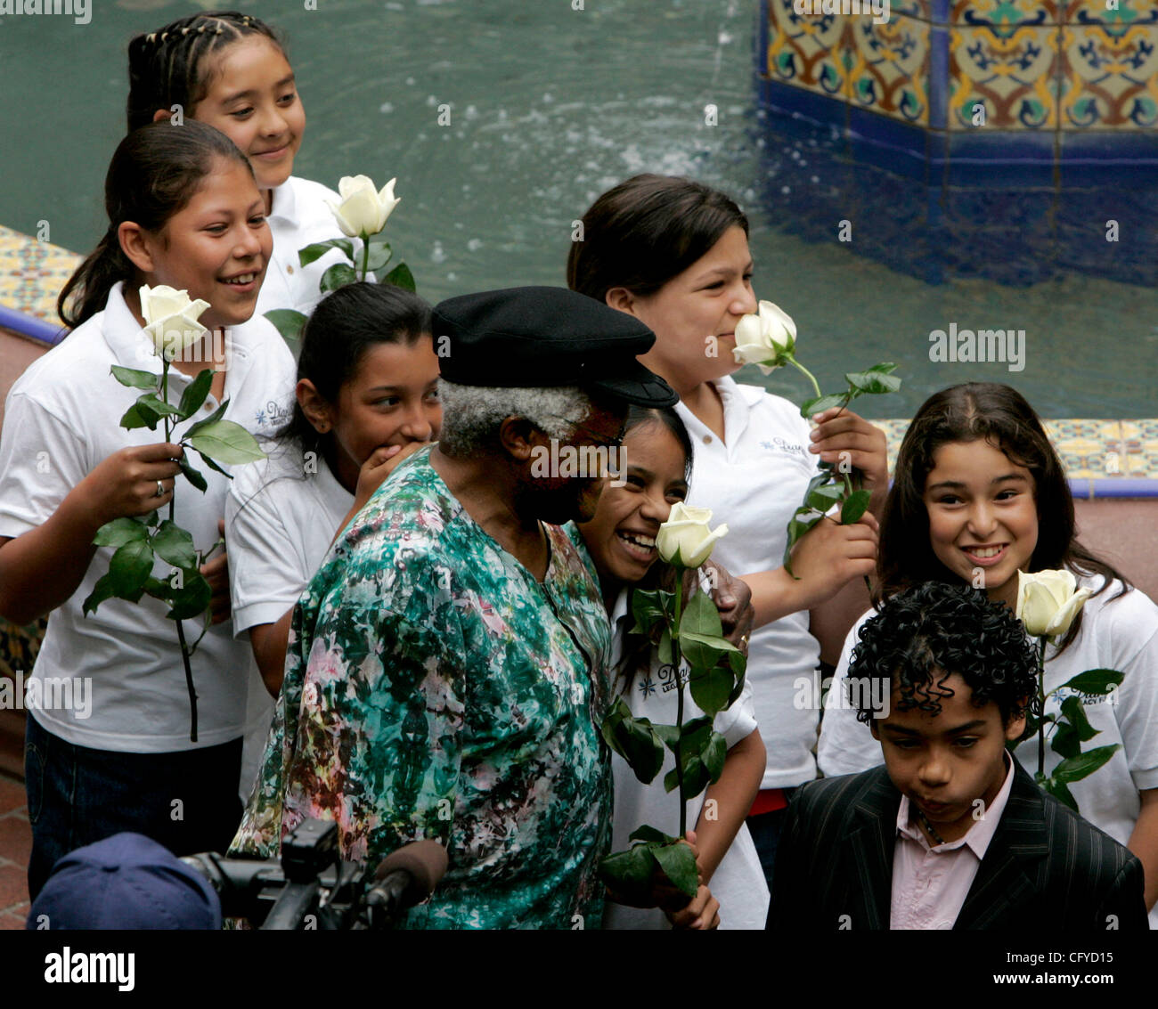 May 15, 2007 Archbishop DESMOND TUTU, center, hugs one of 50 fourth and ...