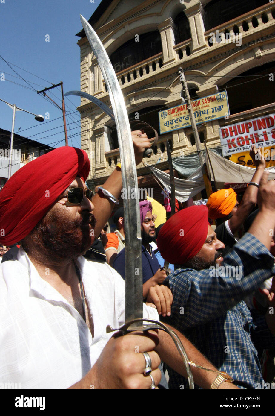 Activists of the various Sikh Organizations carry swords and sticks, as ...