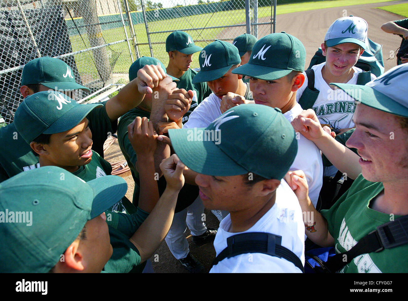 The Moreau Catholic Mariners baseball team gather for a team moment at ...