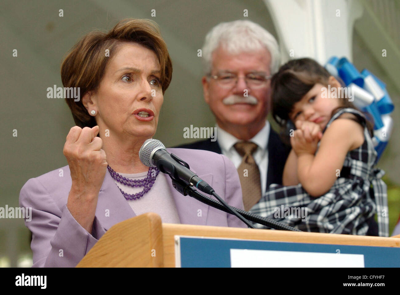 House Speaker Nancy Pelosi (left) speaks while Rep. George Miller looks ...