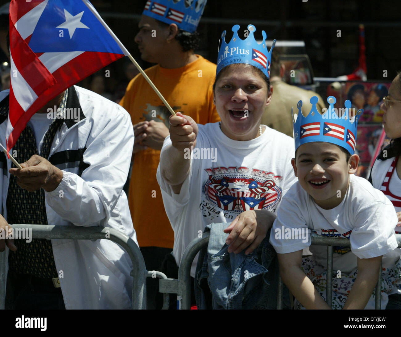Maria Cruz, 40 and her son Adrian, 5 of the Bronx, enjoying the parade ...