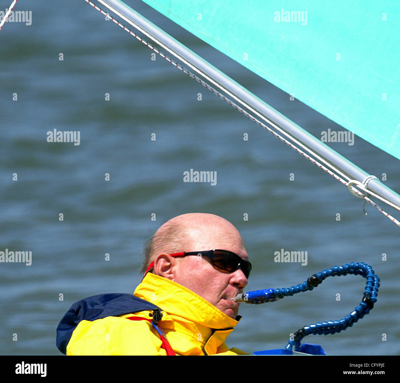 Disabled sailor Fred Hess uses a sip and puff device to controll his ...